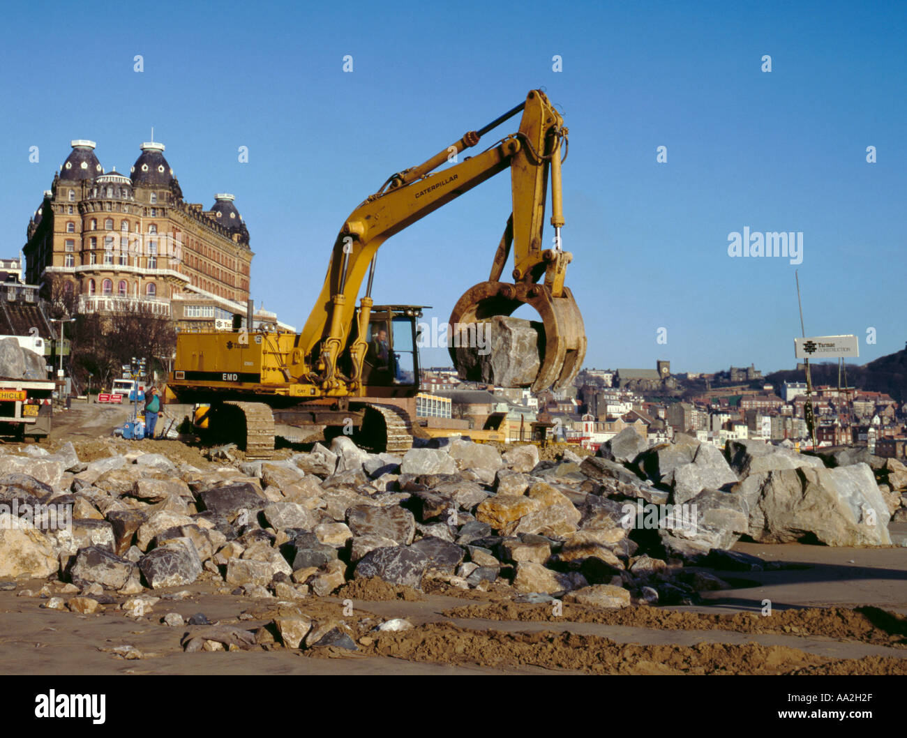 Placing boulder protection to the base of a cliff, Scarborough, North ...