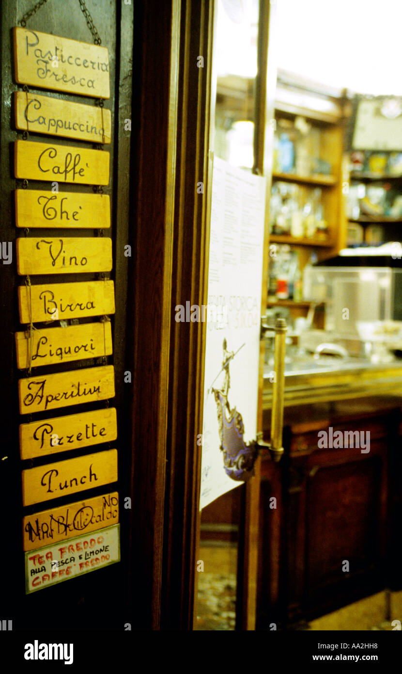 Italy, Venice, A cafe entrance San Marco, wooden menu by open door of ...