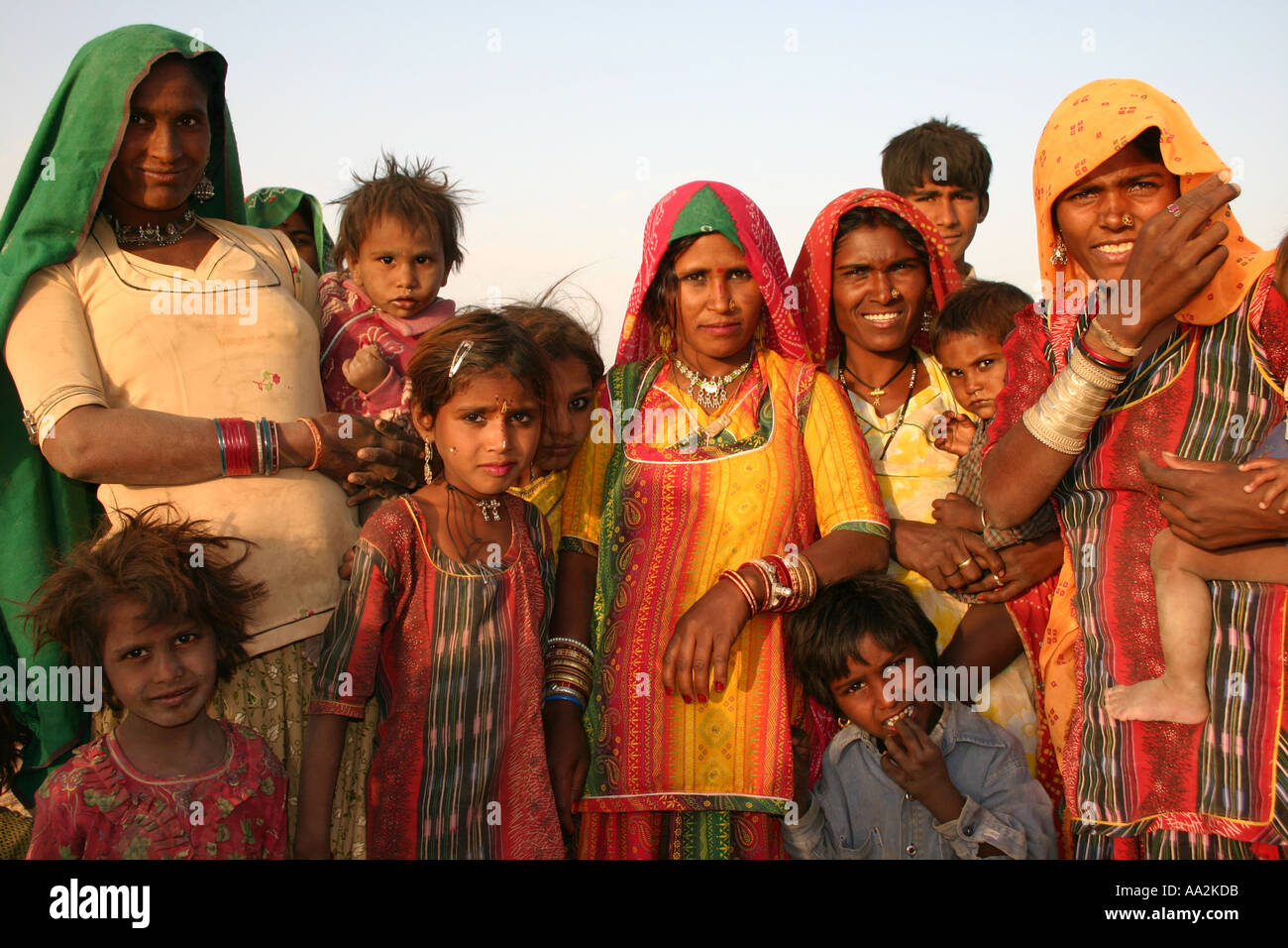 A Rajasthani gypsy community poses in the setting sun Stock Photo - Alamy