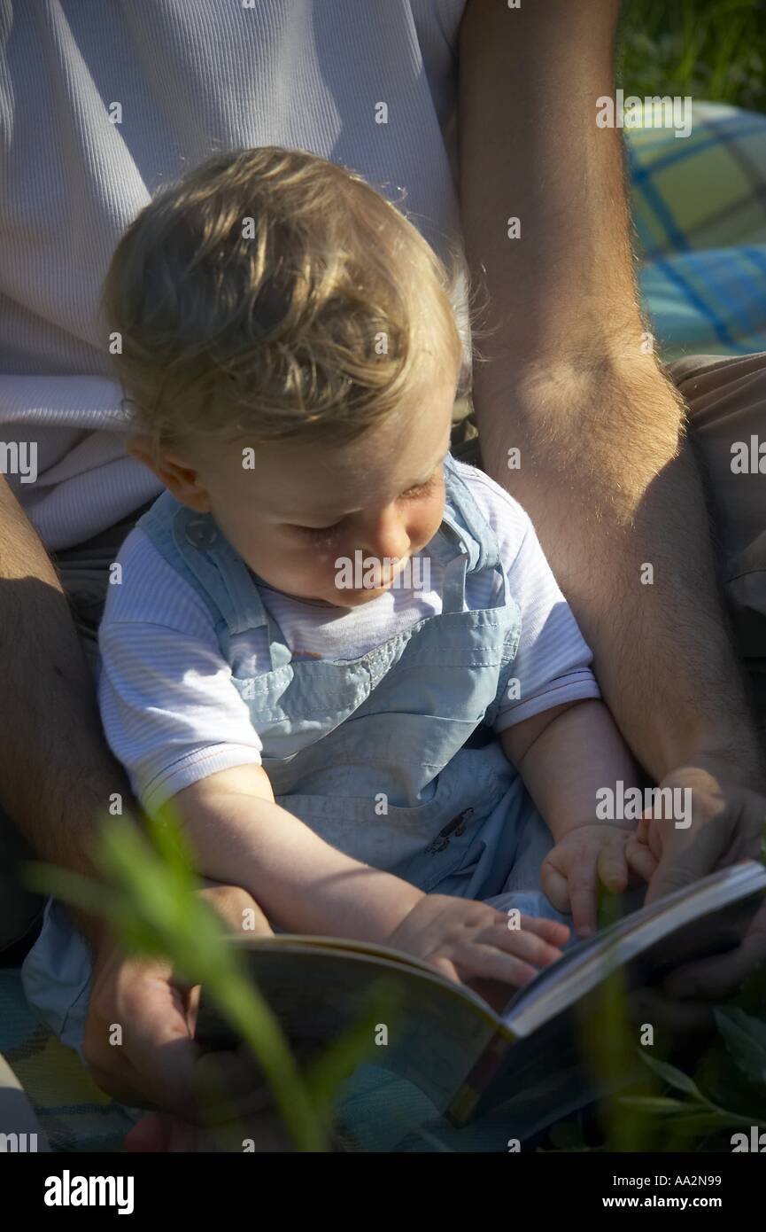 baby playing with book Stock Photo - Alamy