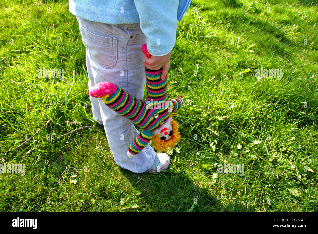 young child holding toy clown Stock Photo - Alamy