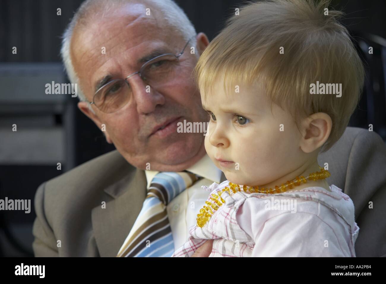 old man with small child Stock Photo - Alamy