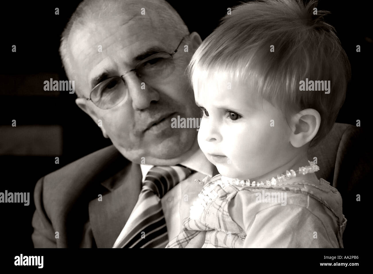 old man with small child Stock Photo - Alamy