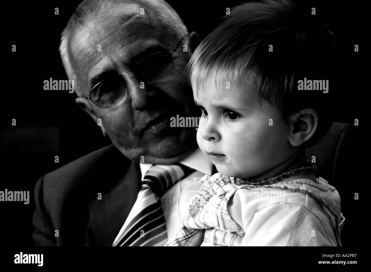 old man with small child Stock Photo - Alamy