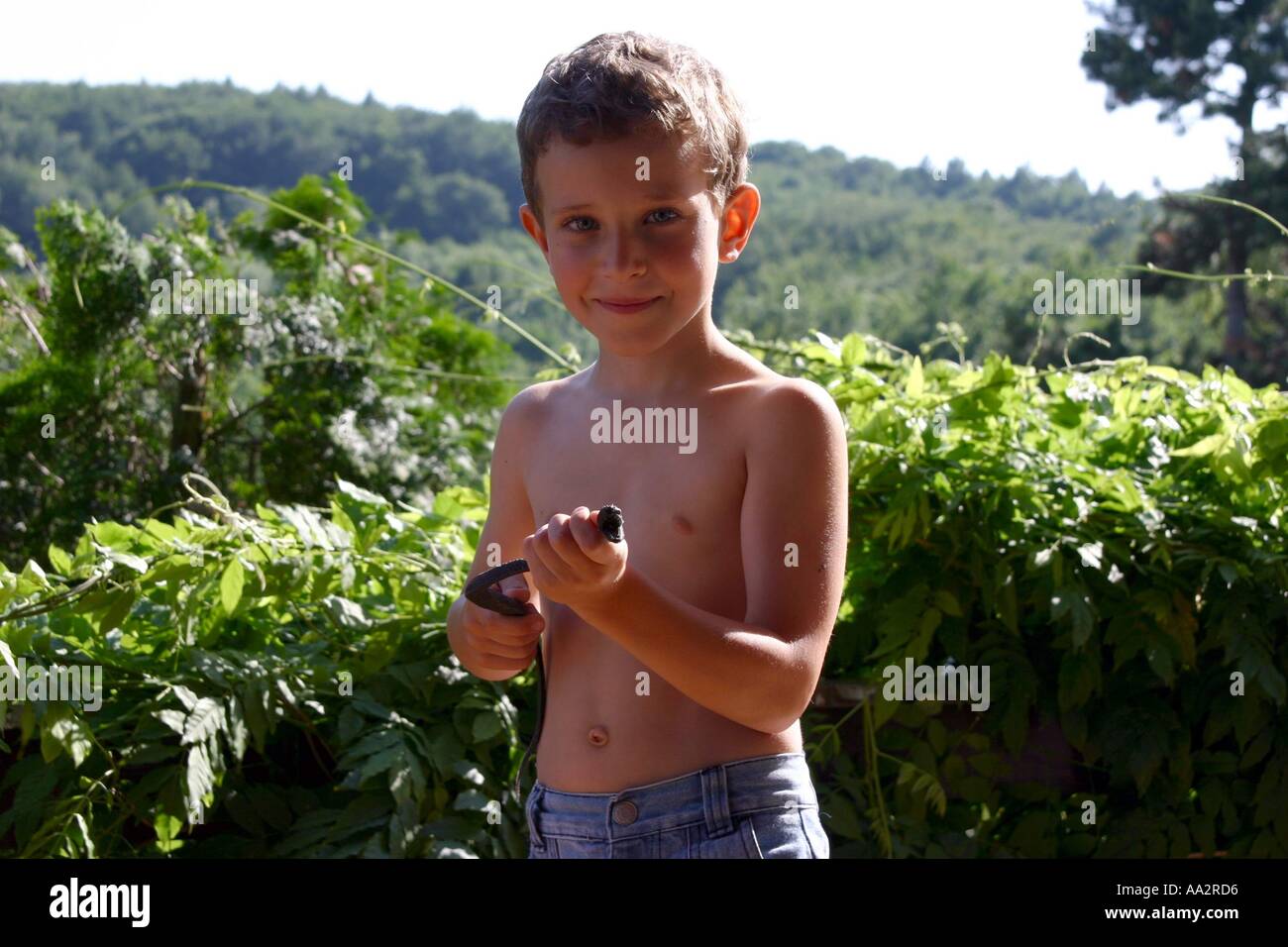 rascal with a snake Stock Photo - Alamy