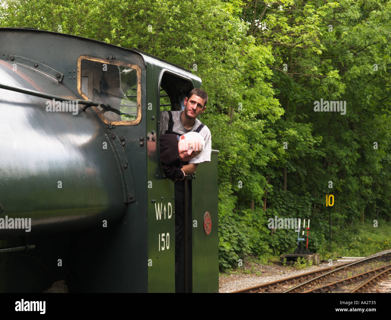 Steam locomotive with driver and fireman Stock Photo - Alamy