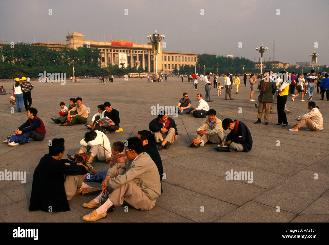 Chinese people, men and women, sitting, relaxing, Tiananmen Square ...