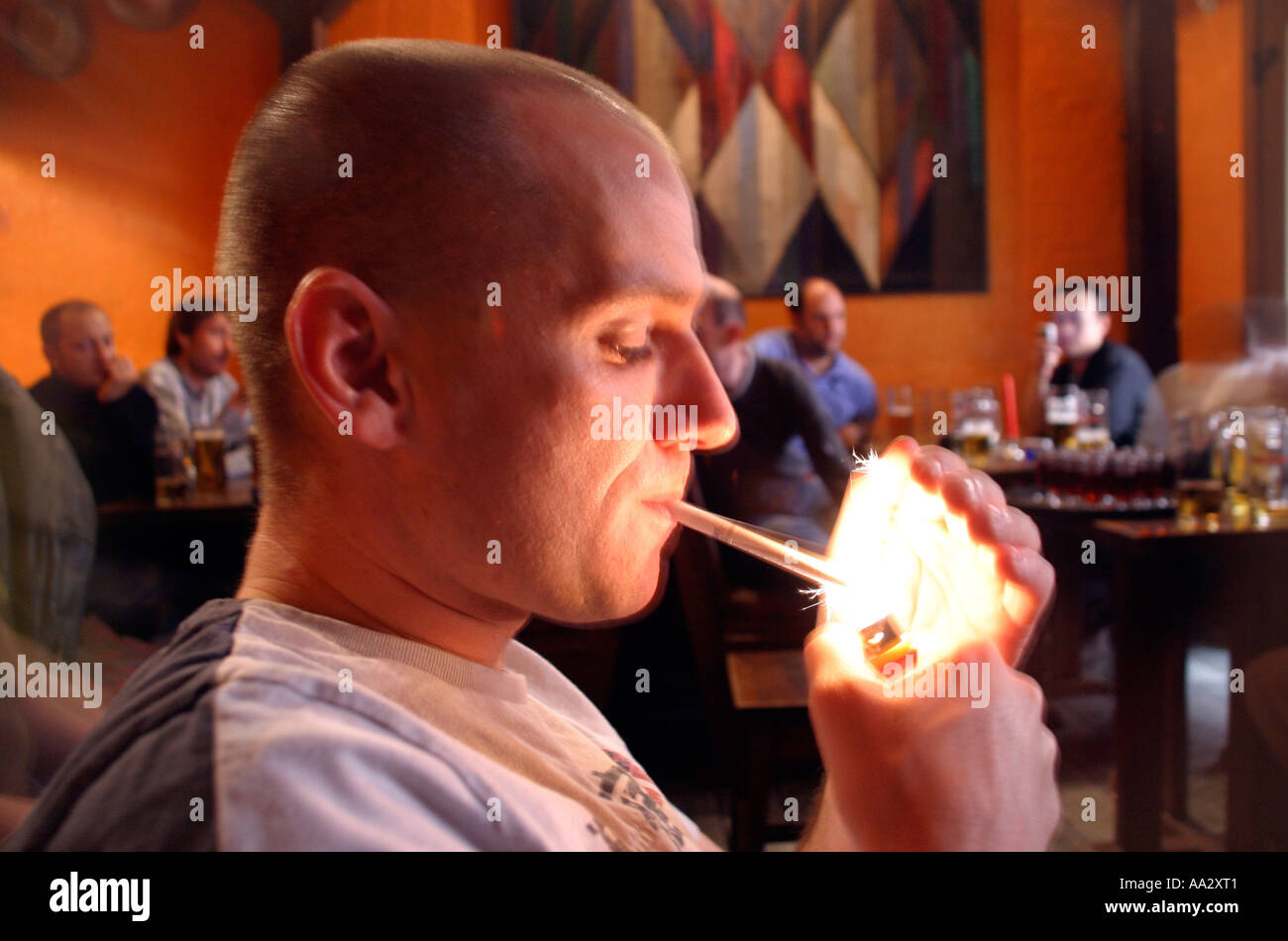 Man lighting a cigarette Stock Photo - Alamy