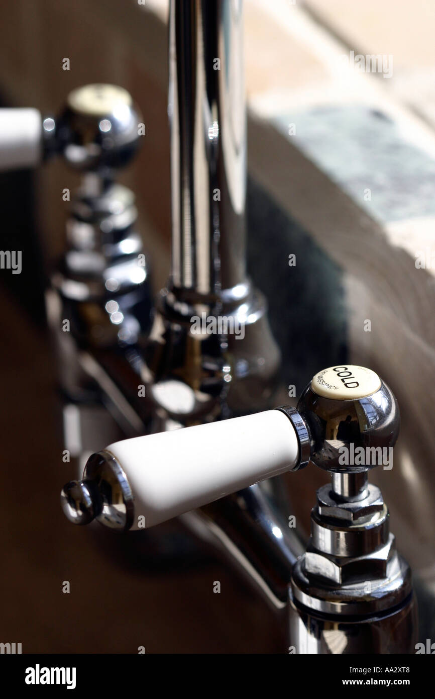 Modern chrome kitchen taps Stock Photo - Alamy