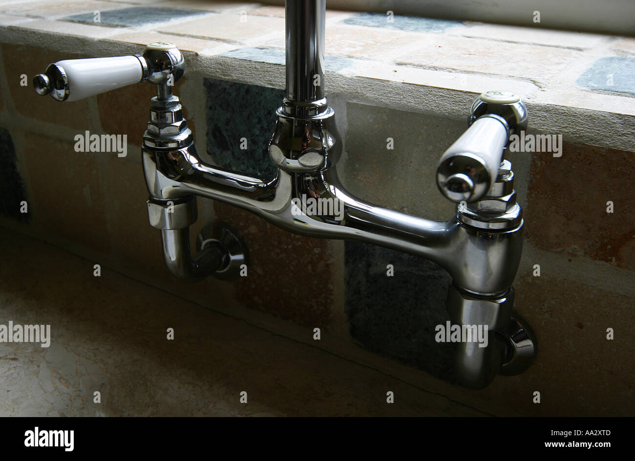 Modern chrome kitchen taps Stock Photo - Alamy