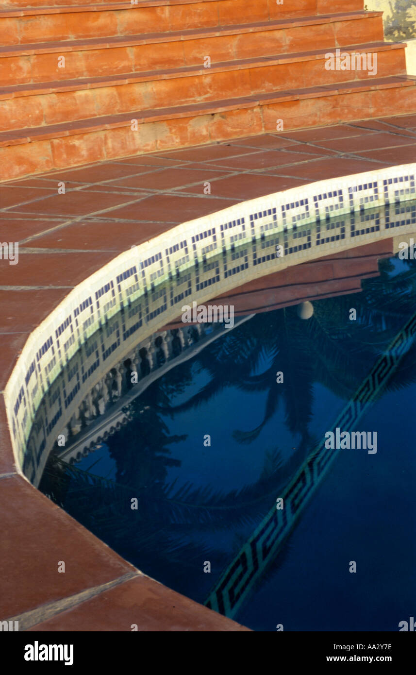 swimming pool with terracotta tiles surround in garden of villa in ...
