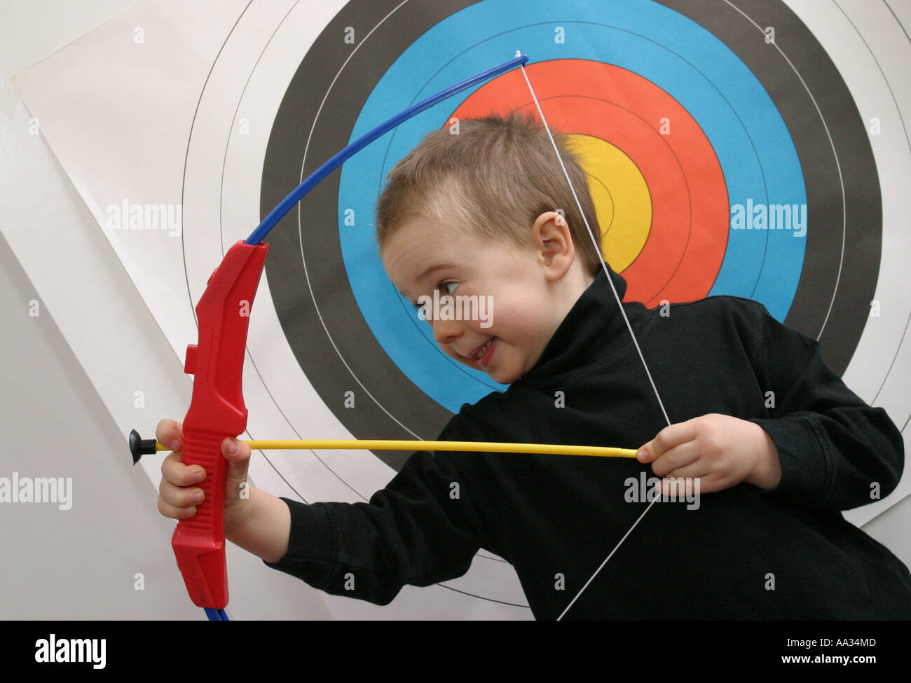 Child shooting arrow hi-res stock photography and images - Alamy