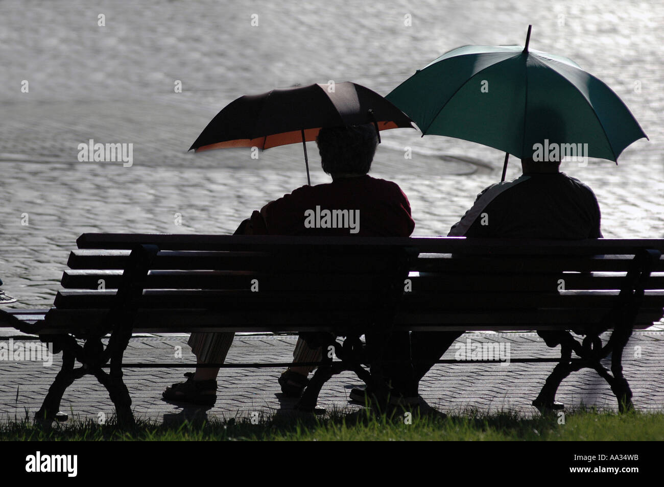 Two people under umbrellas Stock Photo - Alamy