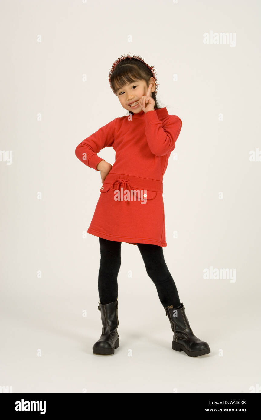 Girl giving peace sign Stock Photo - Alamy