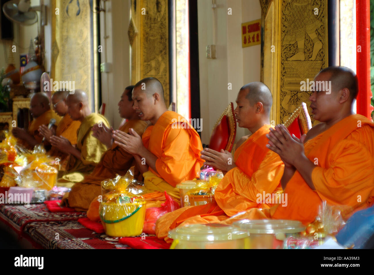 Buddhist monk holding prayers Stock Photo - Alamy