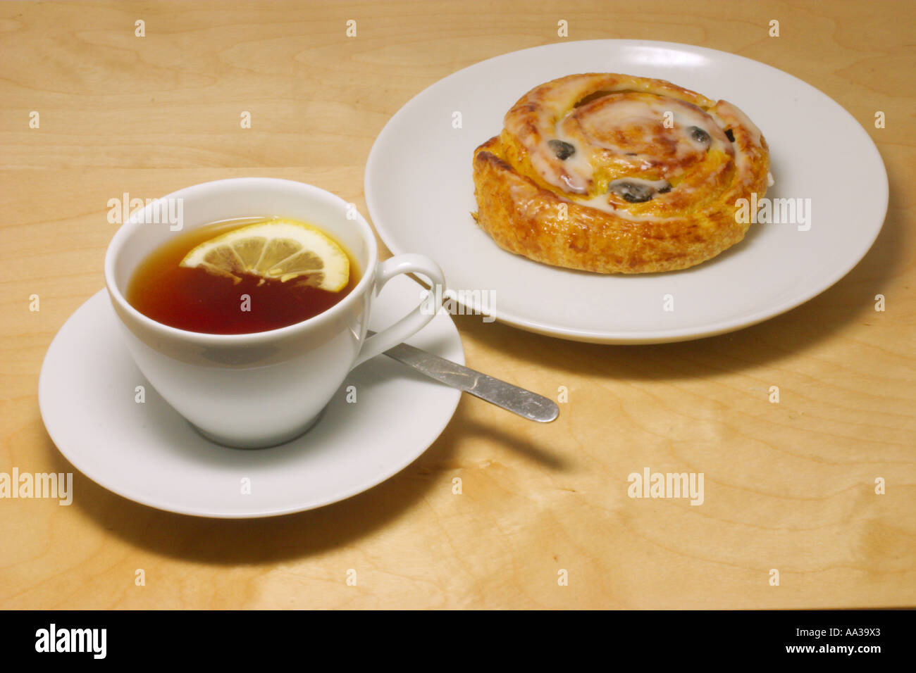 Earl Gray tea with a slice of lemon with a Danish pastry Stock Photo ...