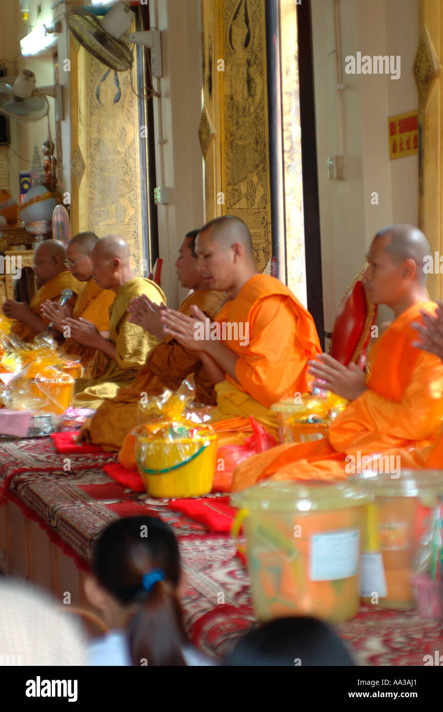 Buddhist monk holding prayers Stock Photo - Alamy