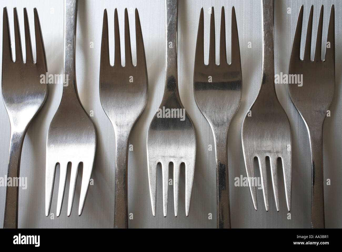 7 Forks in a row Stock Photo - Alamy