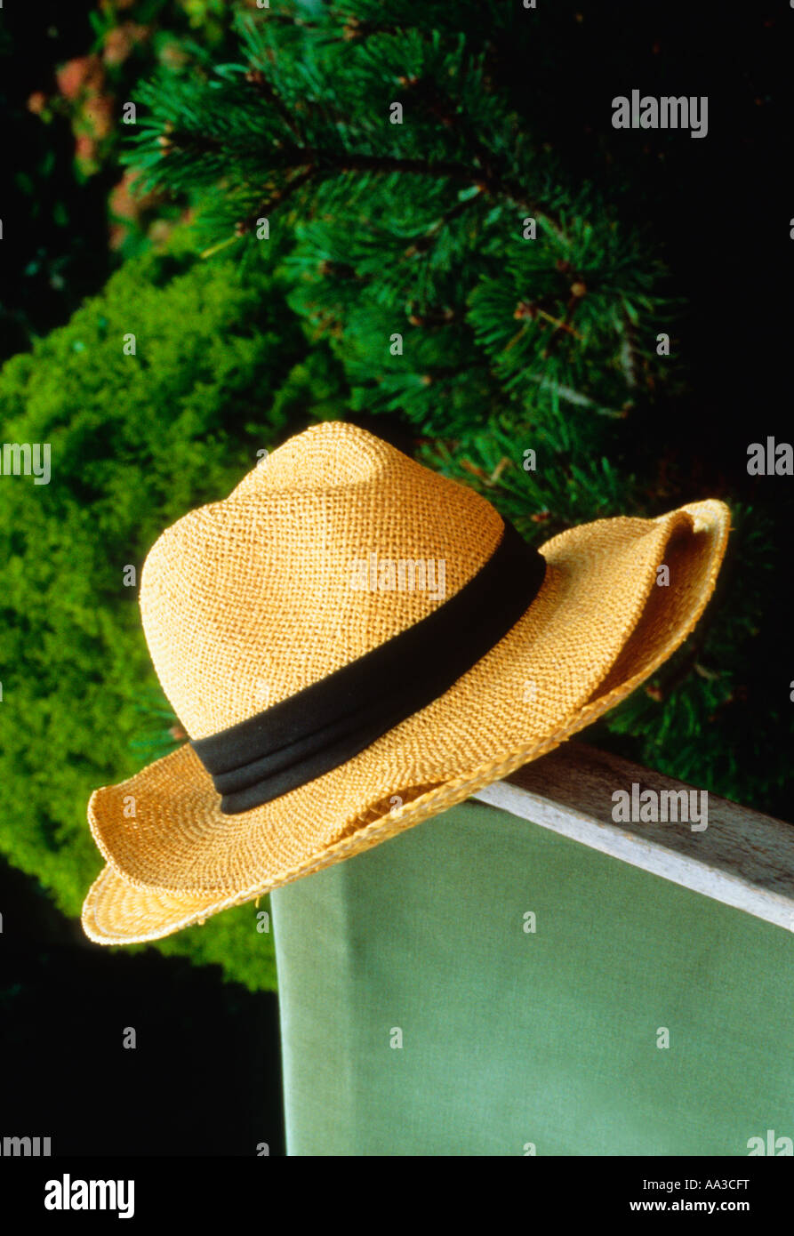 Straw hats on a chair. Summer relaxation Stock Photo - Alamy