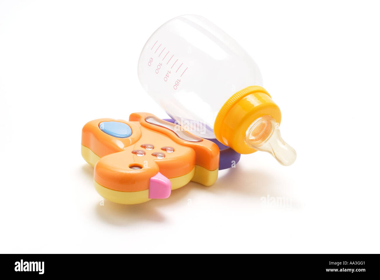 Milk Bottle and Rattle Stock Photo - Alamy