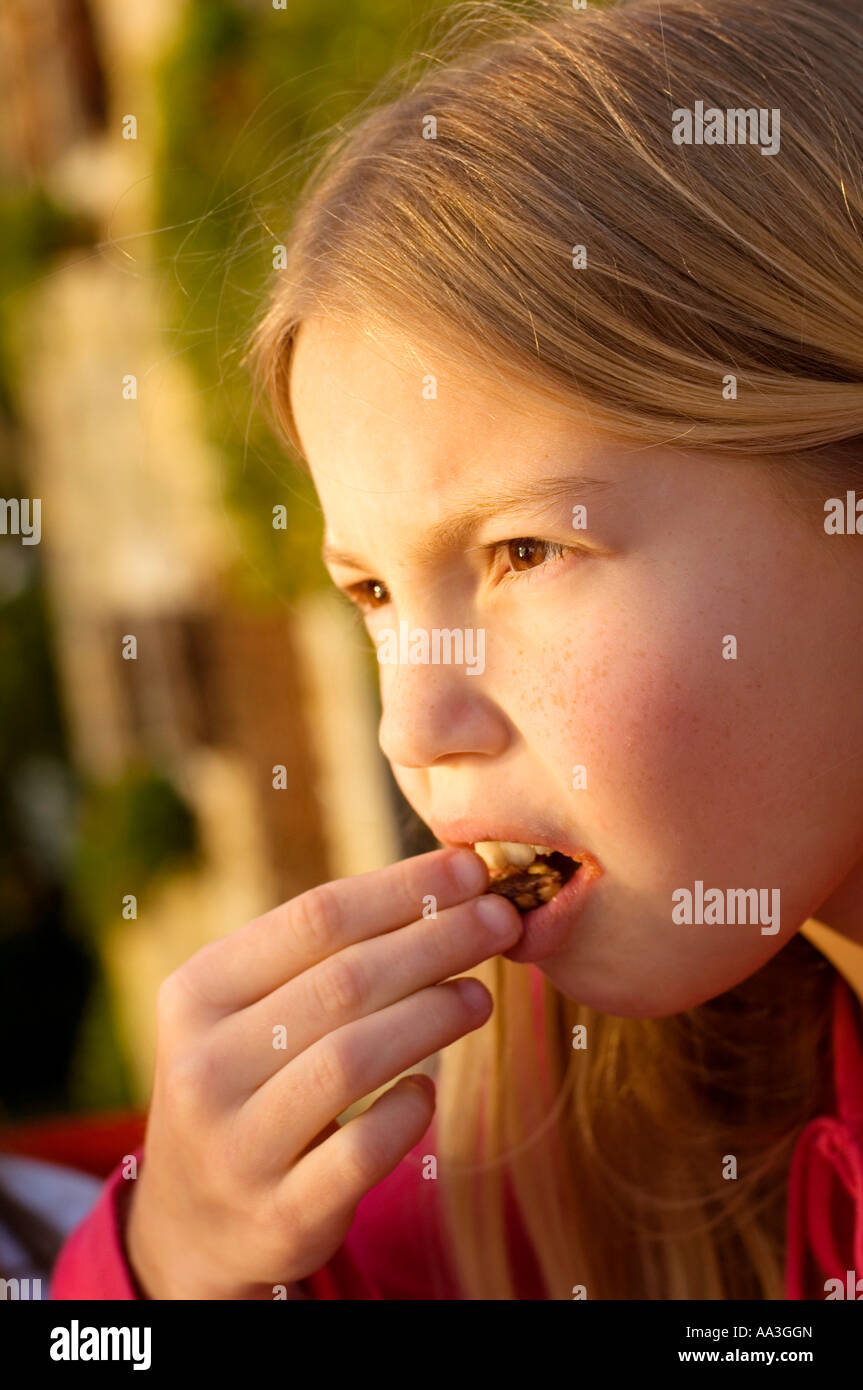 little girl eating chocolate Stock Photo - Alamy