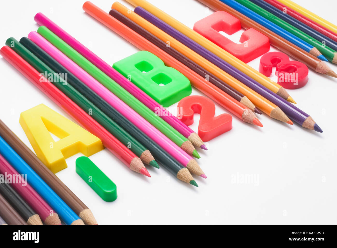 Colour Pencils with Plastic Alphabets and Numbers Stock Photo - Alamy