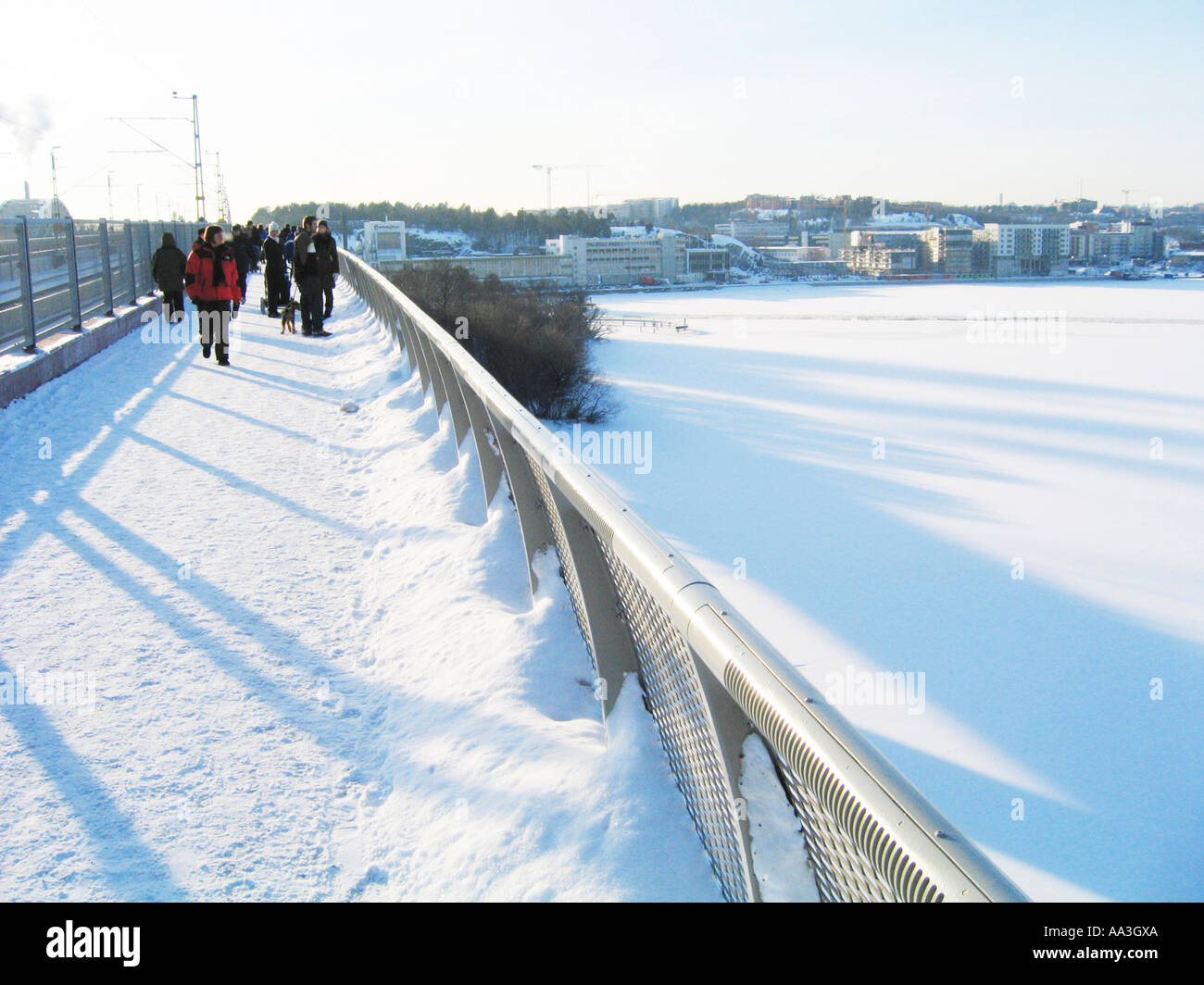 Stockholmers enjoying a Sunday winter walk on the new Årstabron bridge ...