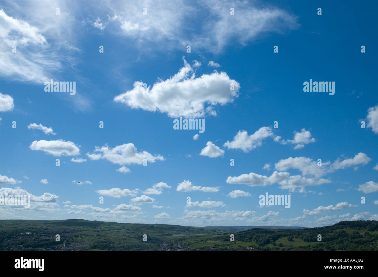 Blue sky and clouds above a rural landscape Stock Photo - Alamy