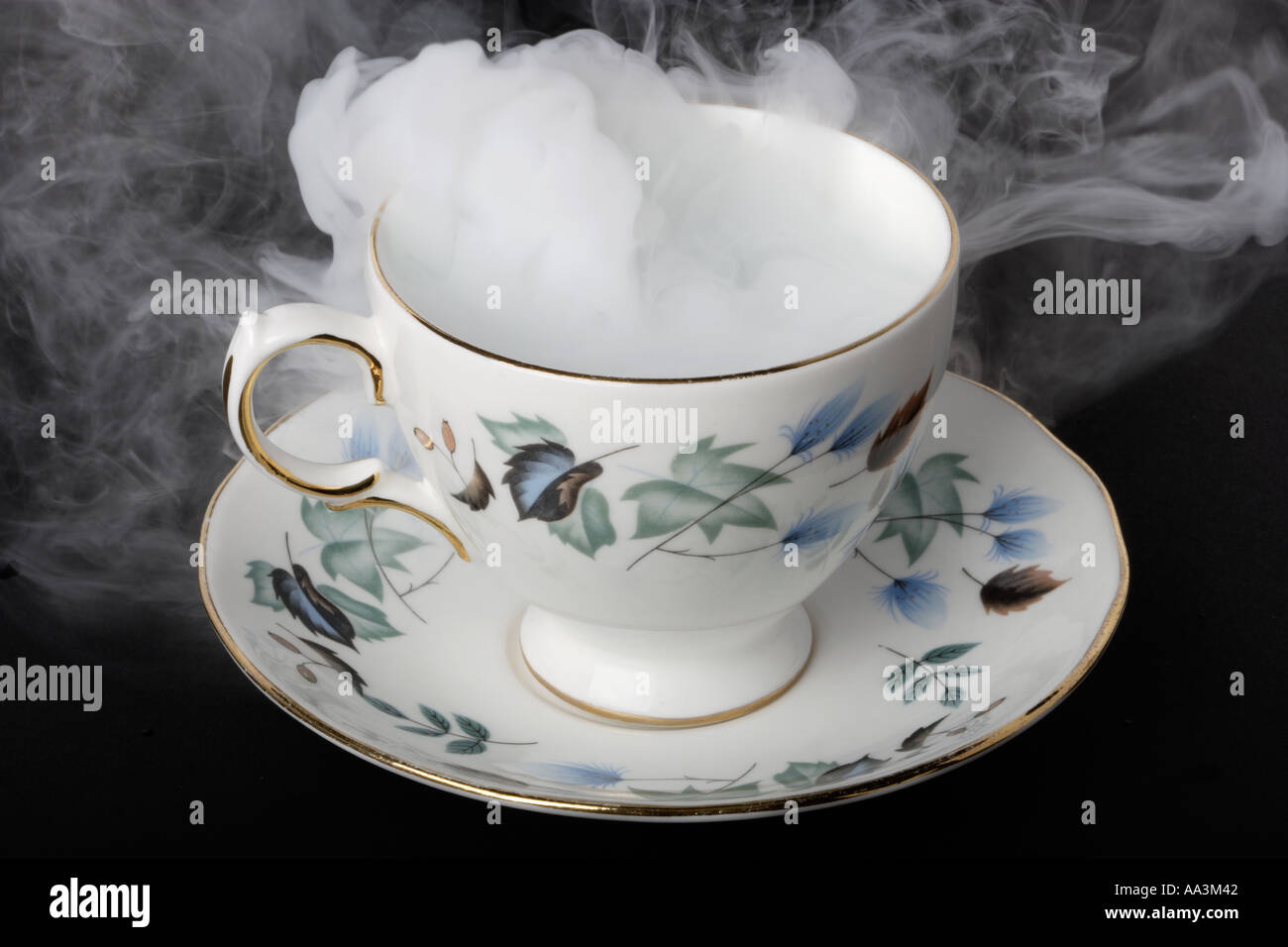 Storm in a teacup Clouds rising from cup Stock Photo - Alamy