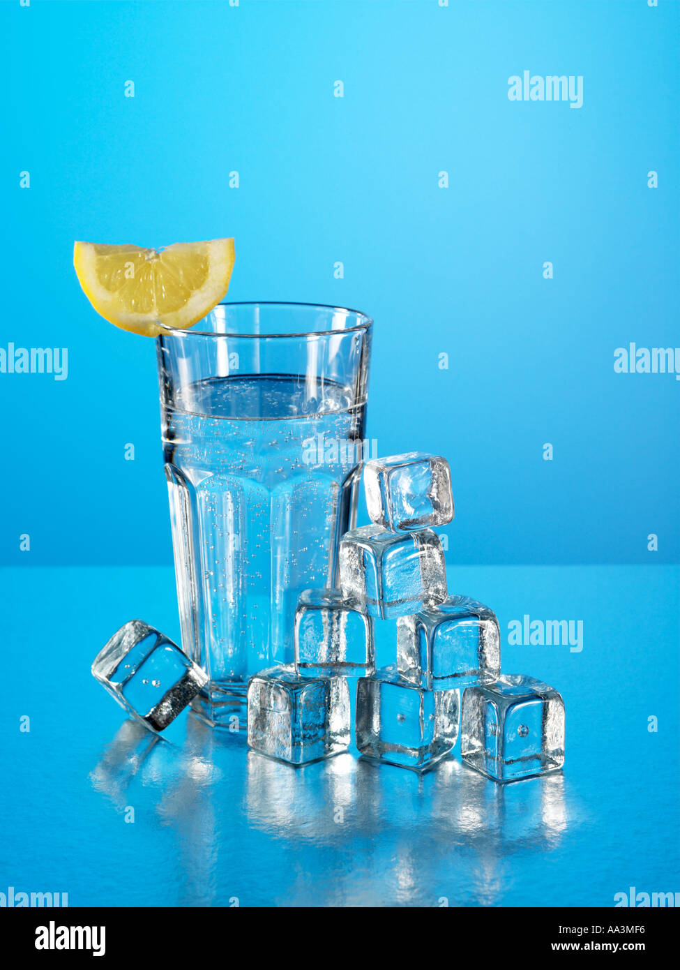Glass of mineral water with ice cubes and lemon Stock Photo - Alamy