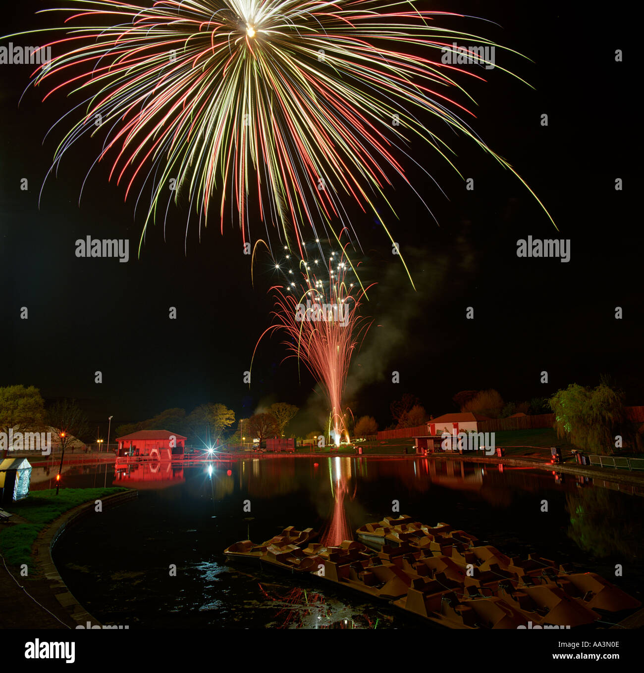Wales Colwyn Bay Eirias Park fireworks display reflected in the lake ...