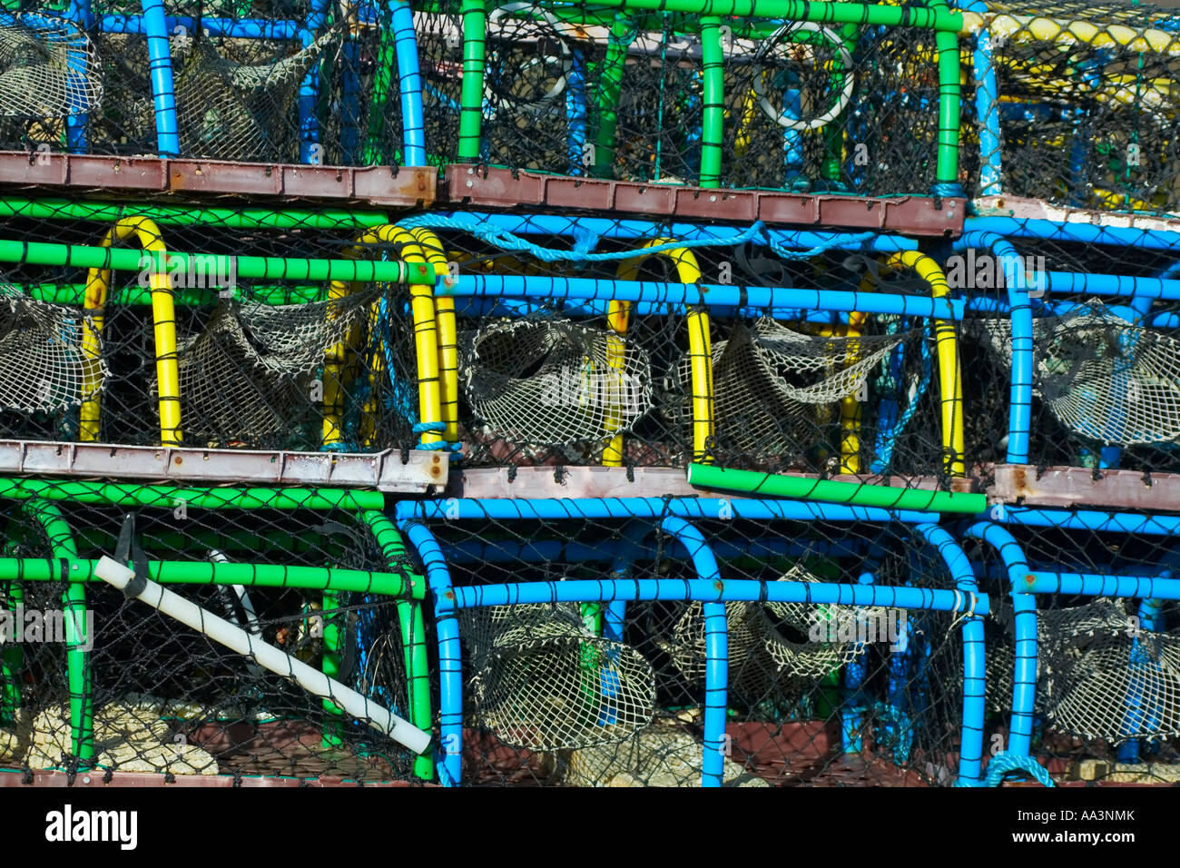 Colourful lobster pots creel stacked up in harbour Stock Photo - Alamy