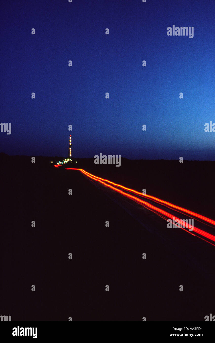 A roughneck for an oil company heads to an oil rig as the sun comes up ...