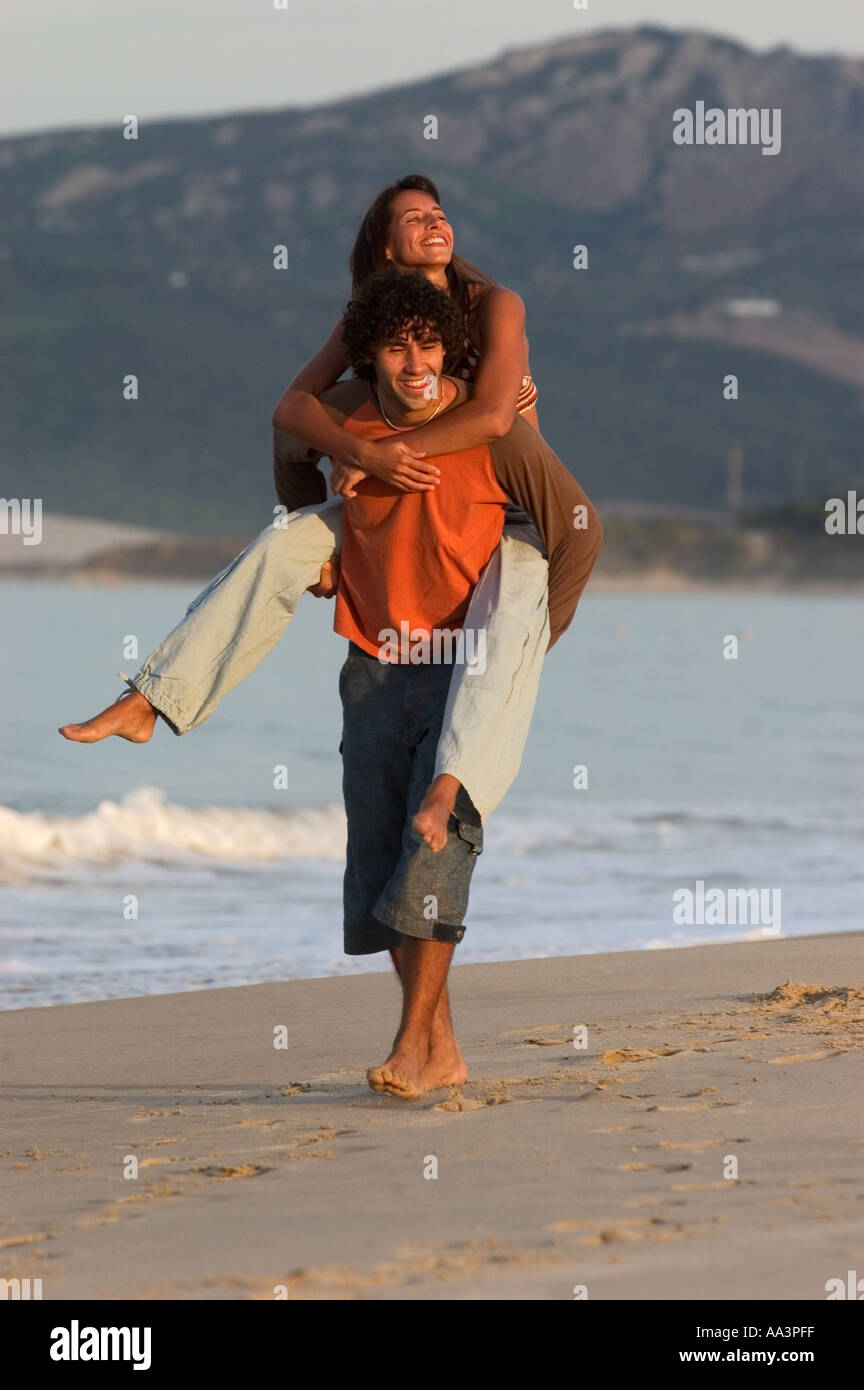 couple at the beach having fun together Stock Photo - Alamy
