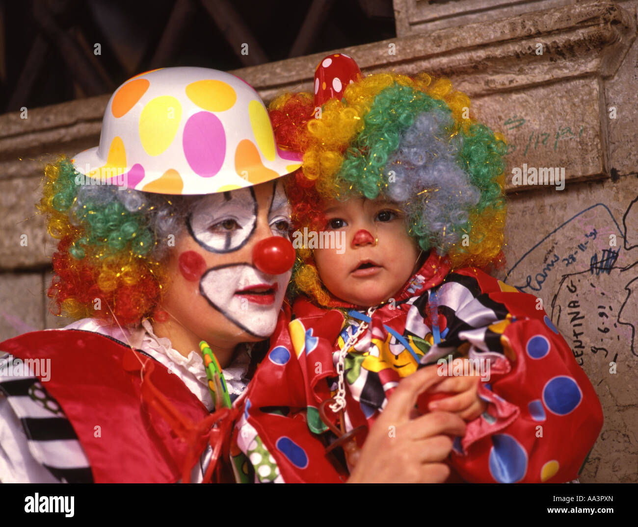 Venice, Veneto, Italy. Venice Carnival clown and young child with ...