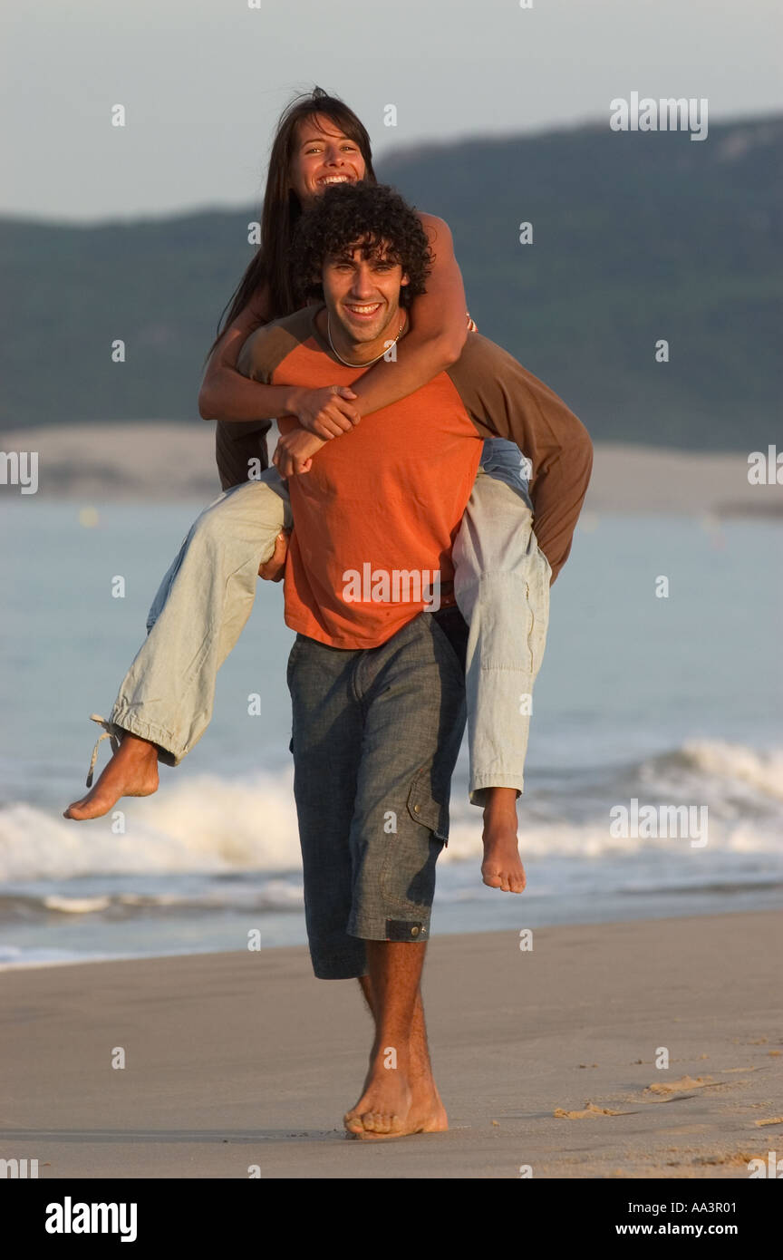 couple at the beach having fun together Stock Photo - Alamy