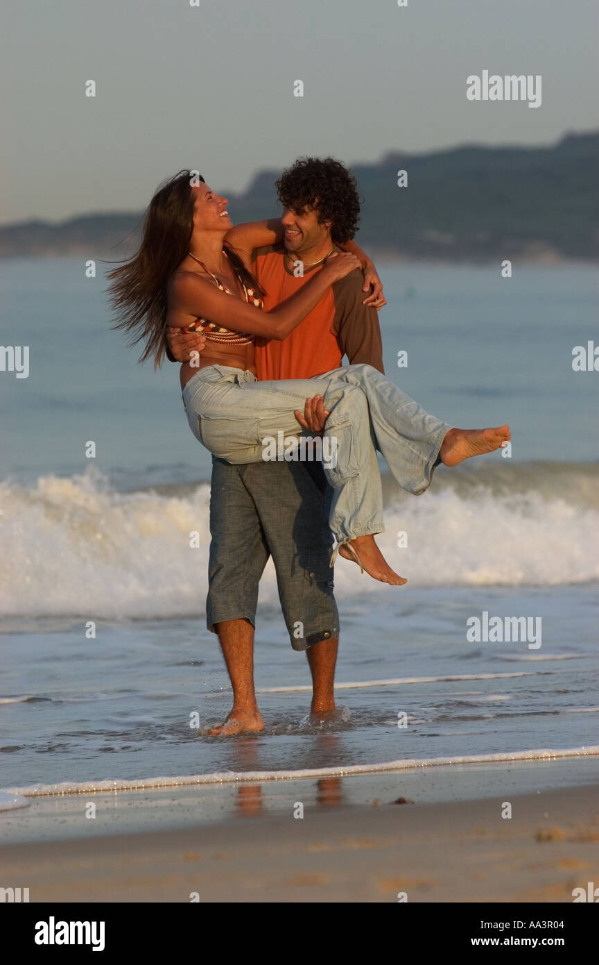 couple at the beach having fun together Stock Photo - Alamy