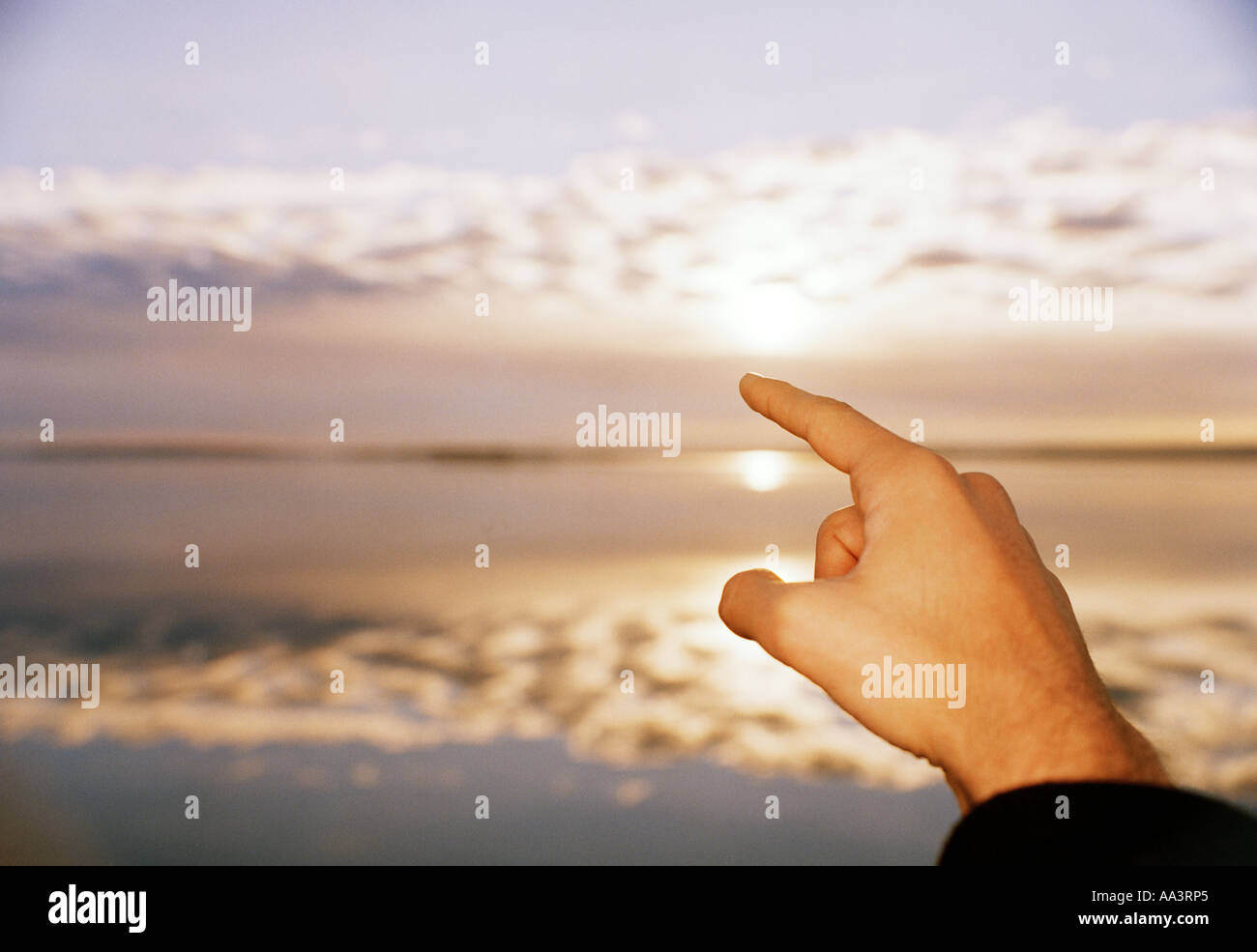 Index finger lifted against heaven hi-res stock photography and images ...