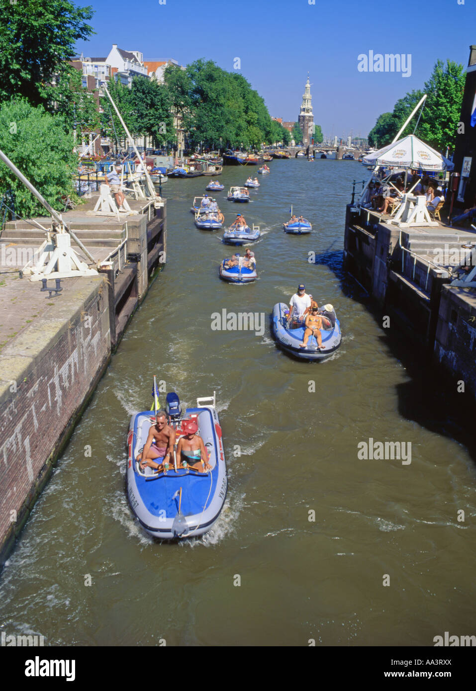 Amsterdam, Netherlands. Inflatable boats passing through Oude Schans ...