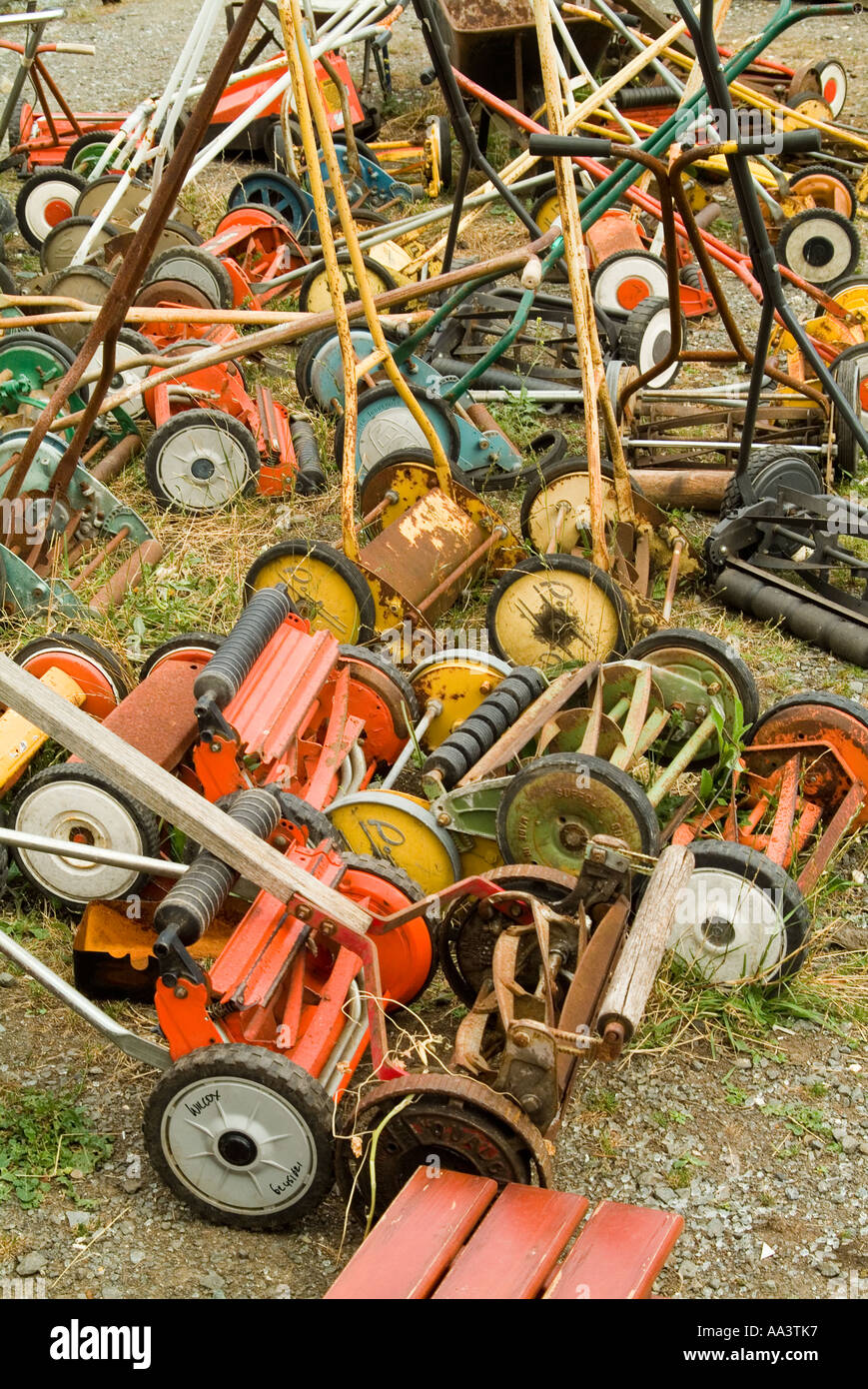 Old discarded and rusted hand lawnmowers at a recycling depot Stock ...