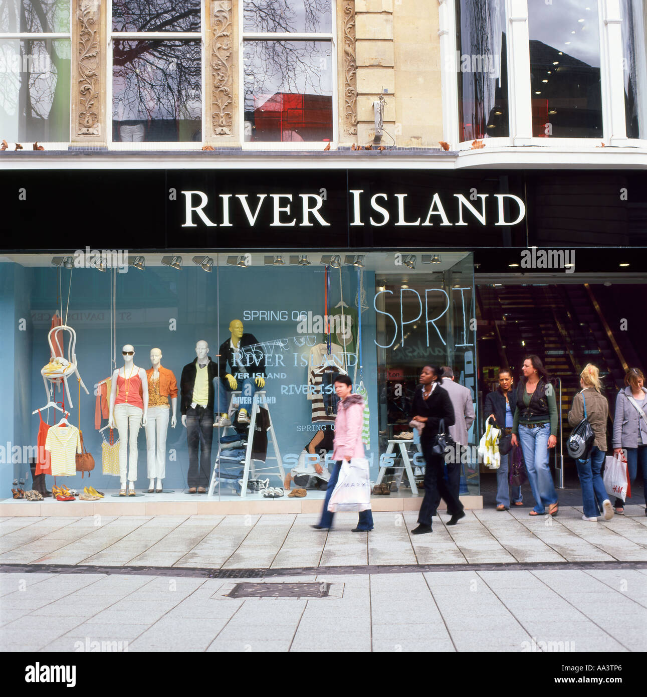 Shoppers walking past the River Island retail store at Queen Street ...