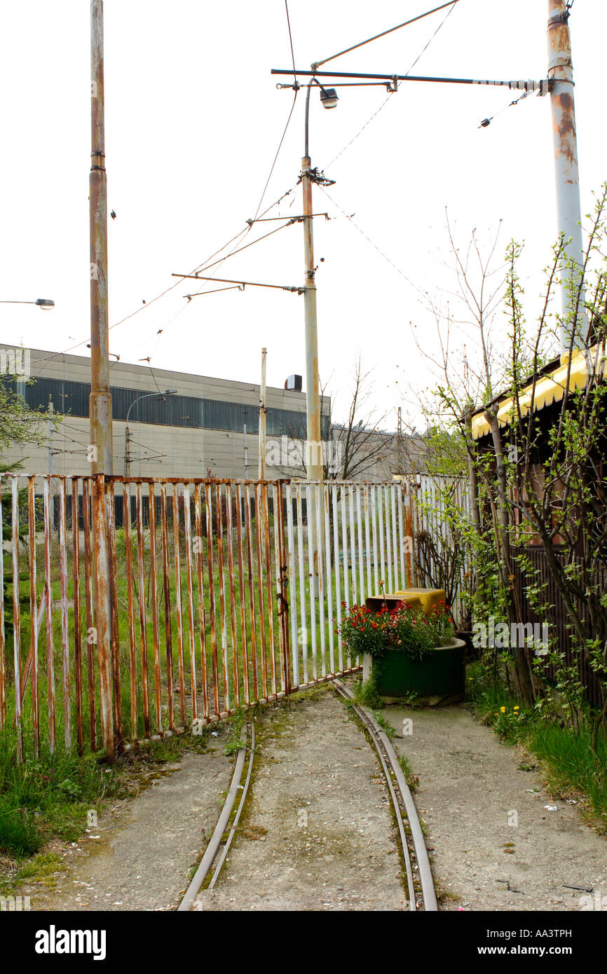 disused factory gate with railroad tracks Stock Photo - Alamy