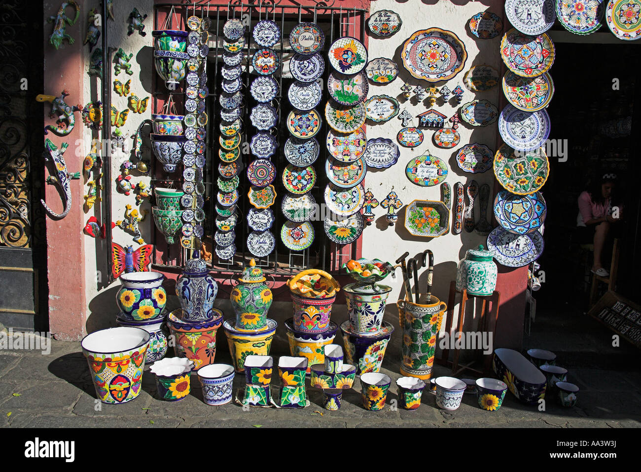 Pottery items for sale on a pavement, outside a gift and craft shop ...