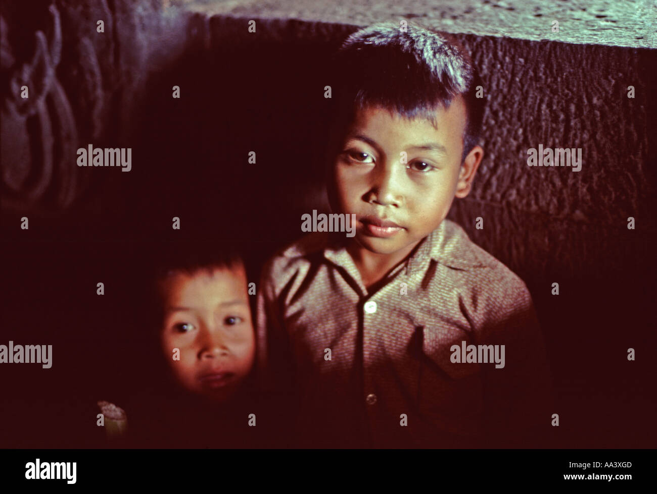 Two Javanese boys in a temple near Jogjakarta Indonesia Stock Photo - Alamy