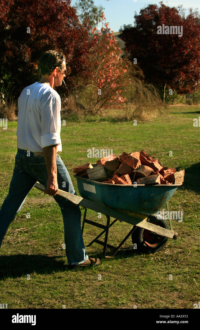 Using wheelbarrow hi-res stock photography and images - Alamy