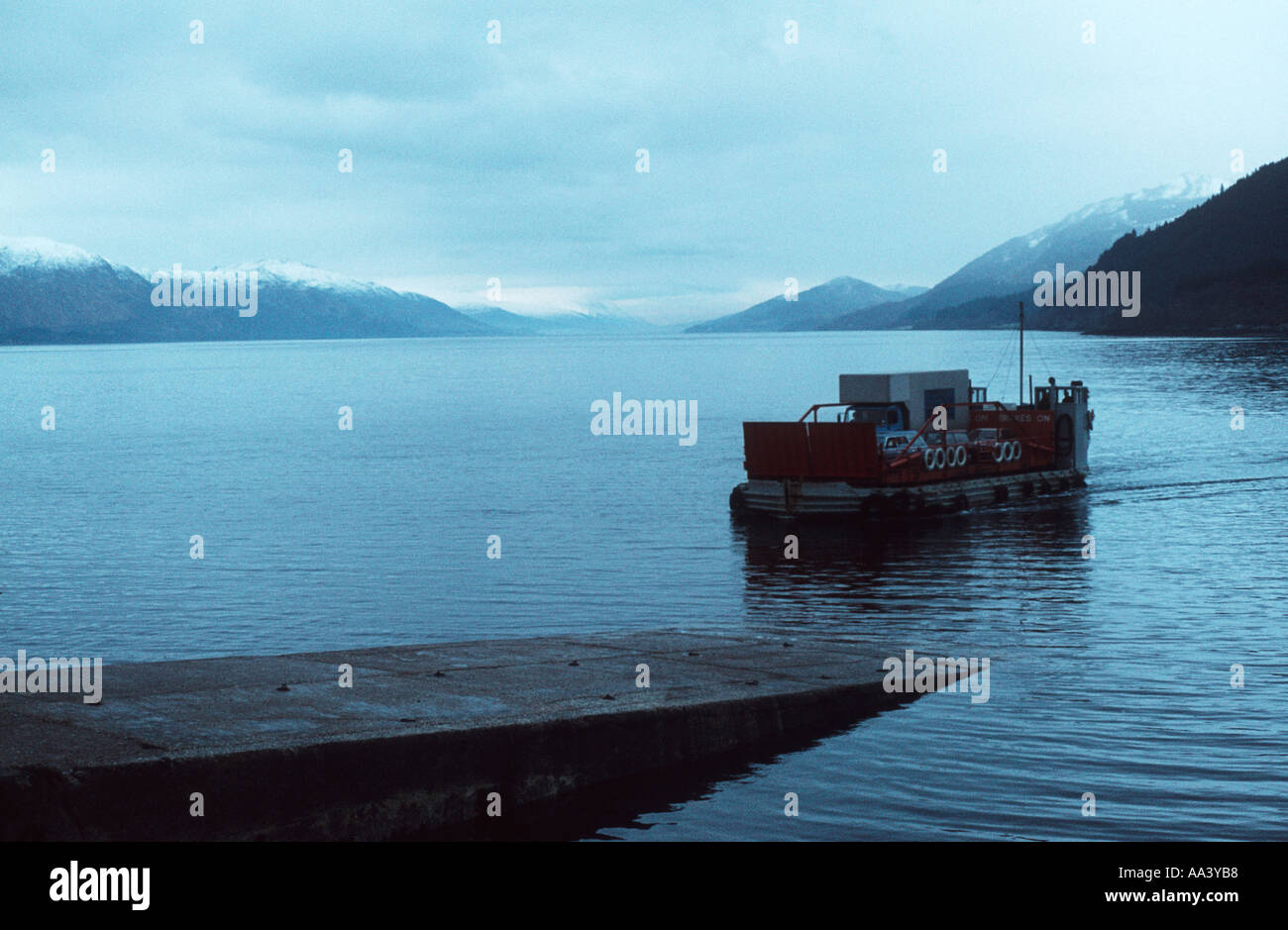 Island ferry in Scotland carrying several vehicles in winter Stock ...