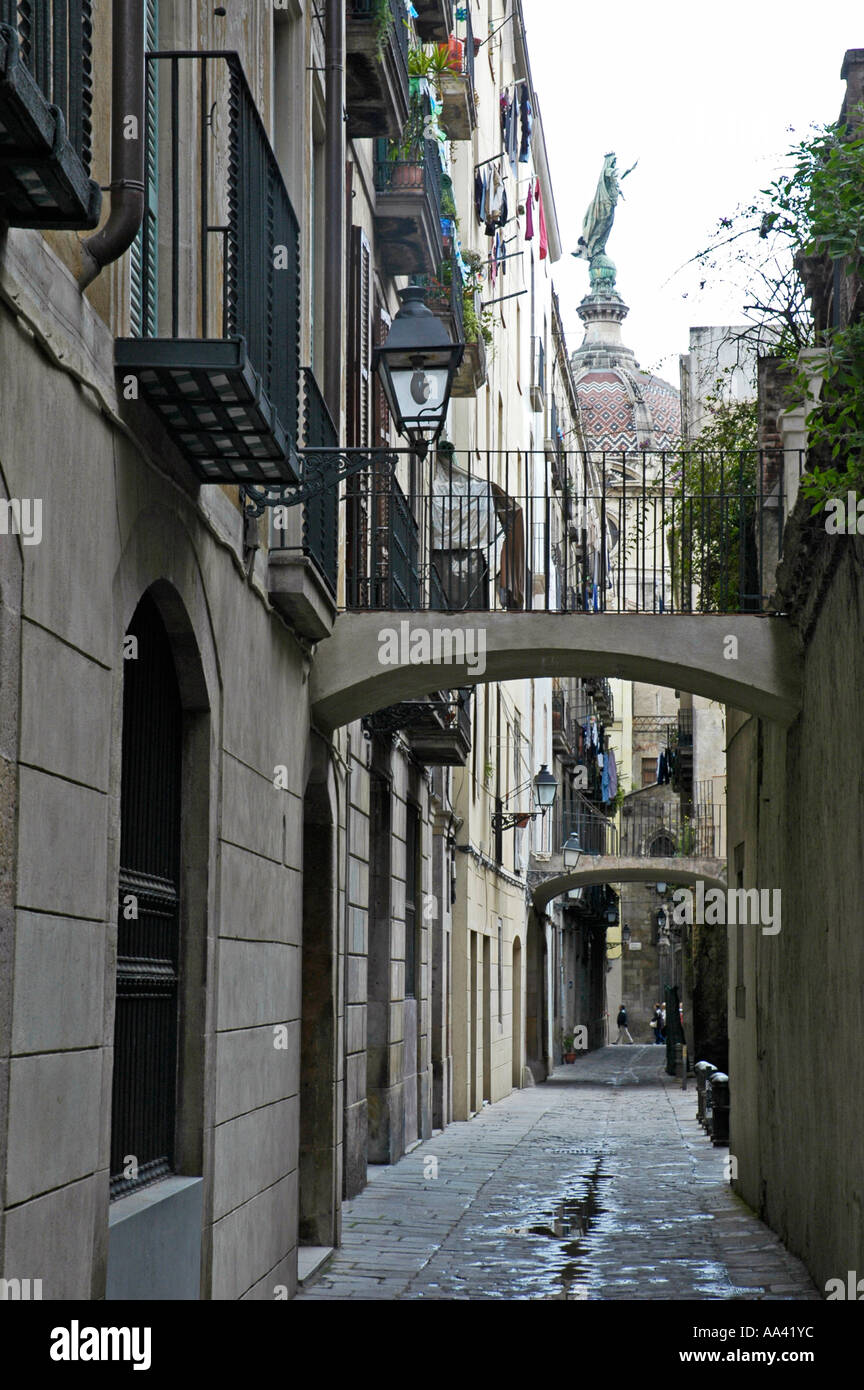 Narrow lane with bridges for pedestrians between the houses, gothic ...