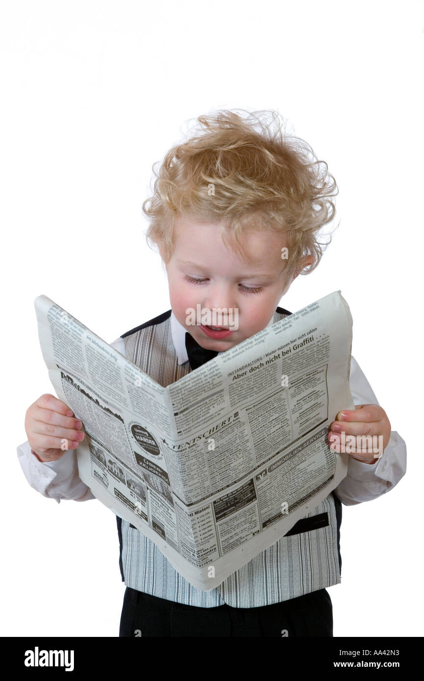 Boy reading newspaper hi-res stock photography and images - Alamy