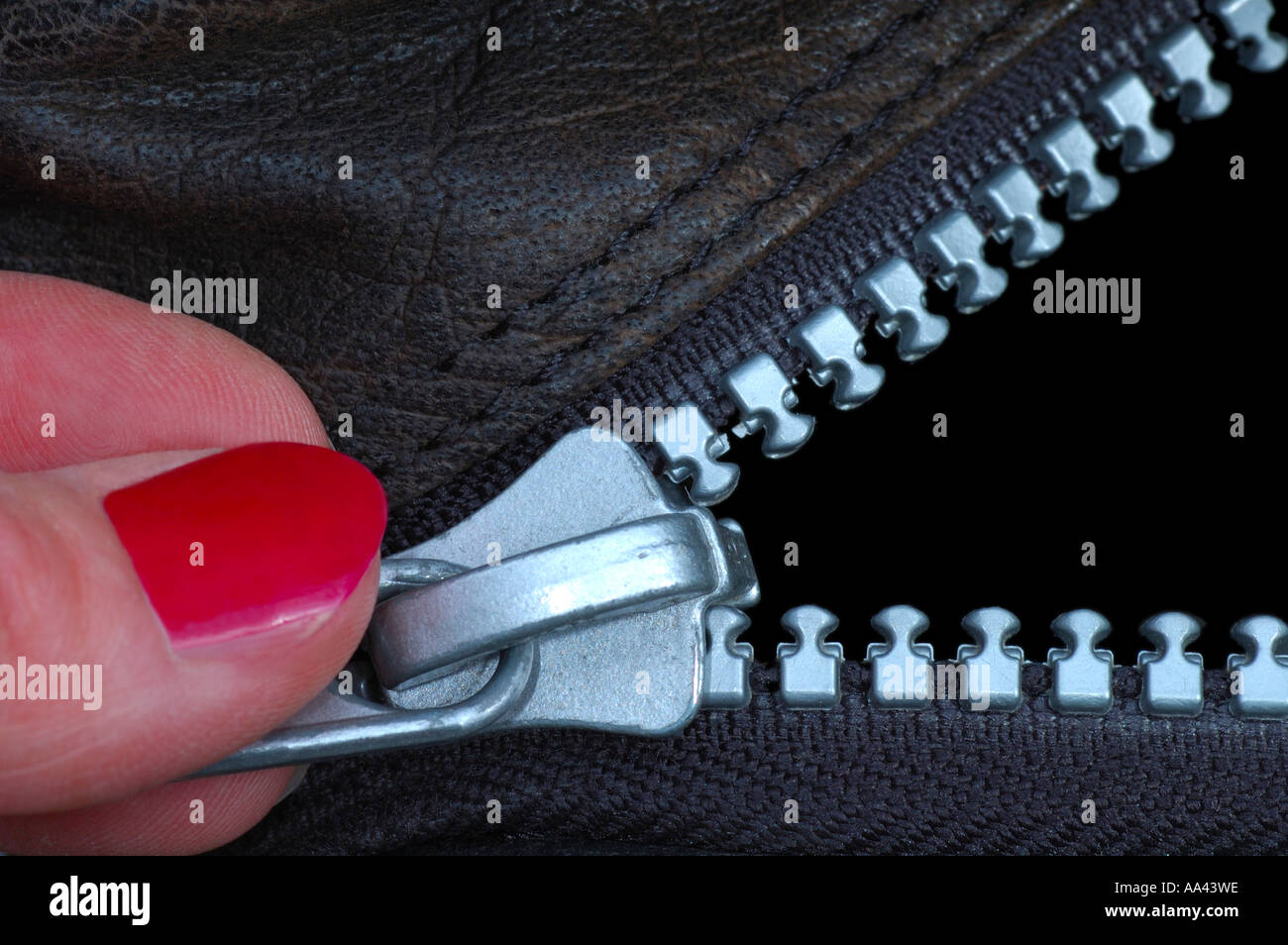Opening zip fastener Stock Photo - Alamy