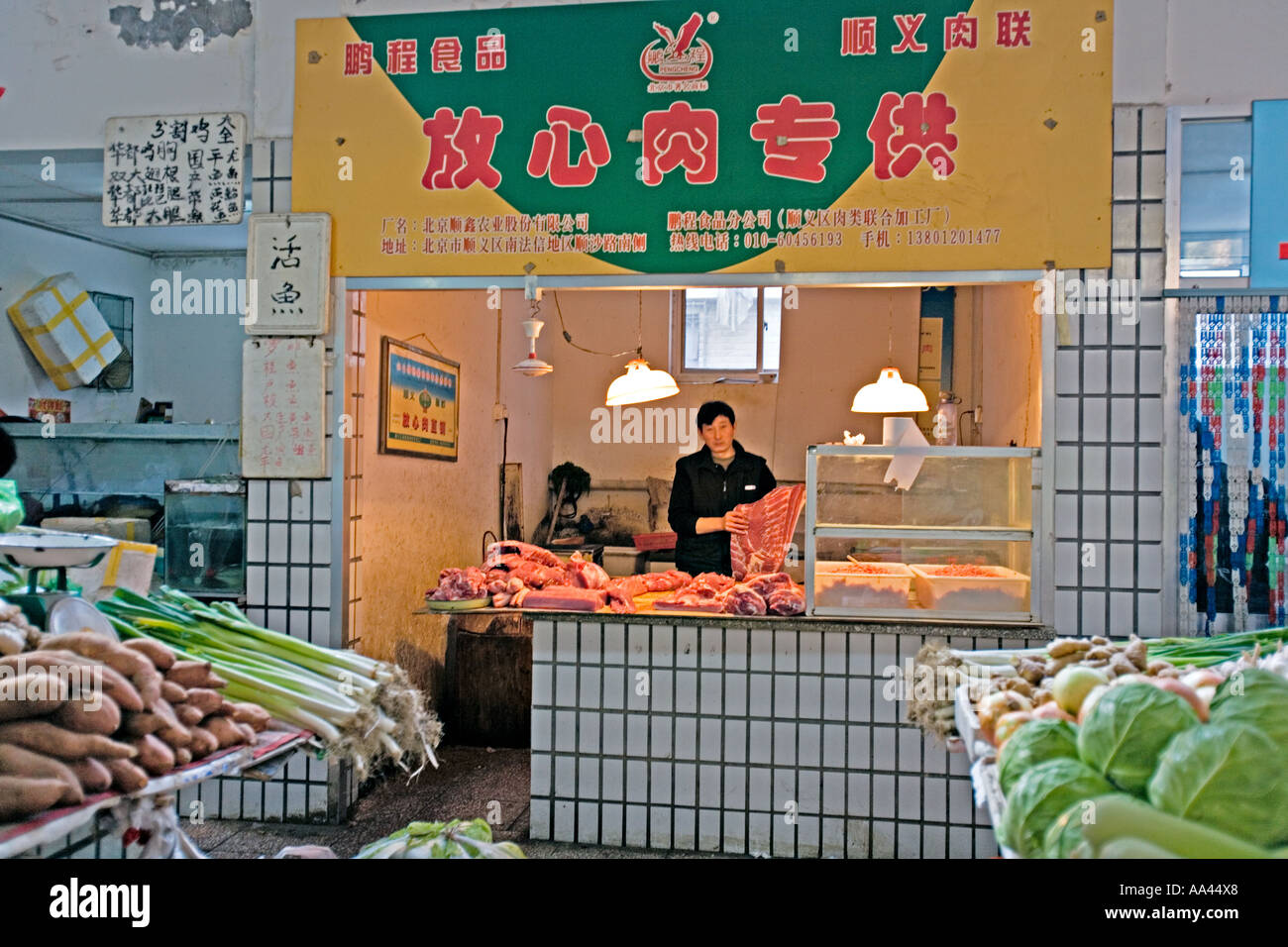 CHINA BEIJING Small independent butcher shop in the middle of ...